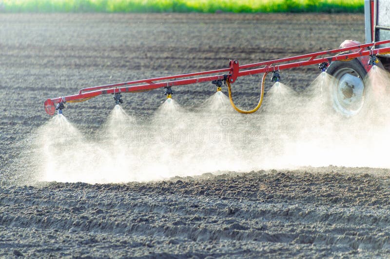 Agricultural irrigation system spraying water on field with water ...