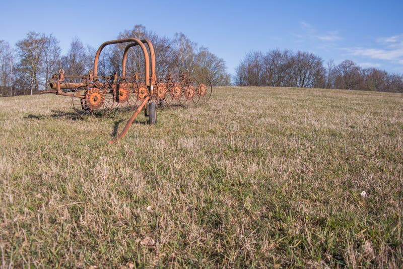 An Agricultural Machine for Raking Grass. Meadows on a Hill Stock Photo ...