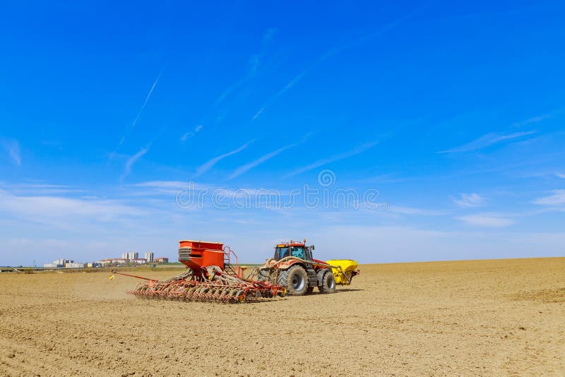 Tractor with Seeder Sows Grain. Carrying Out Complex of Spring Field ...