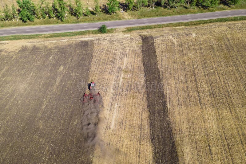 Agricultural Track Tractor with Plowing System Working on Field Stock ...