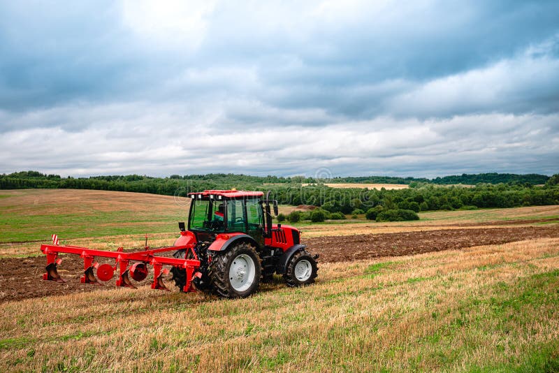 Agricultural Tractor Plowing the Field Stock Photo - Image of ...