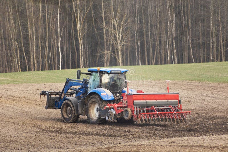Agricultural Tractor with Seeder in the Field, Spring Day Stock Image ...