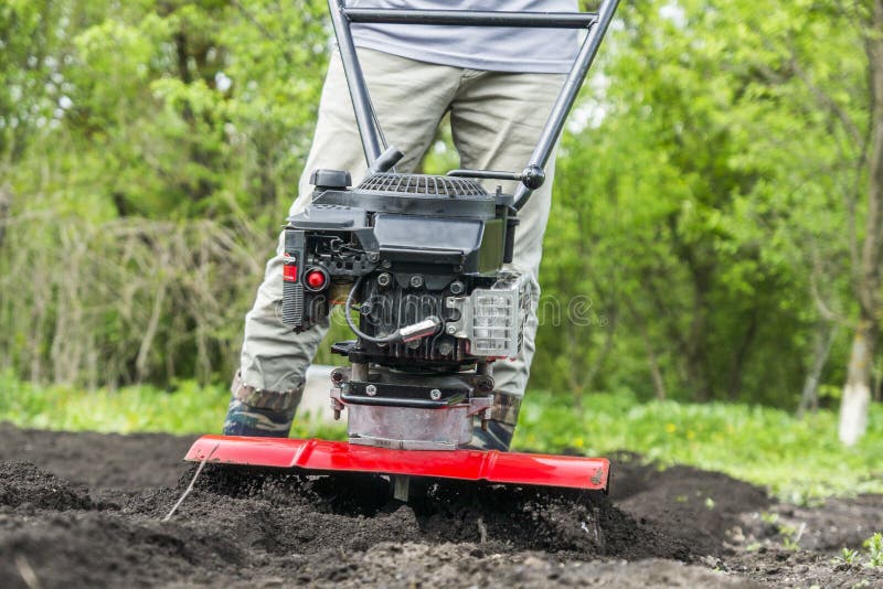 The Man is Engaged in Agricultural Work, Works the Soil Stock Image ...