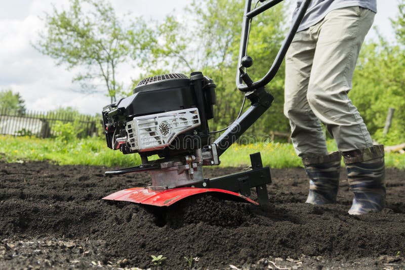 The Man is Engaged in Agricultural Work, Works the Soil Stock Image ...