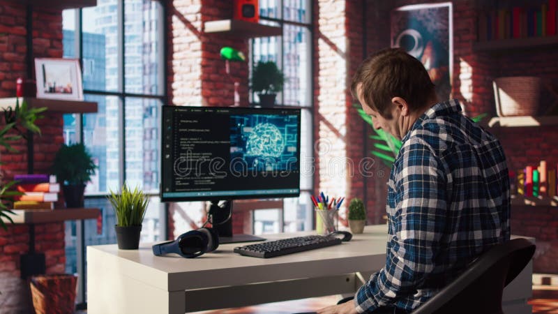 AI Engineer in Home Office Stretching Back while Looking at PC Screen ...