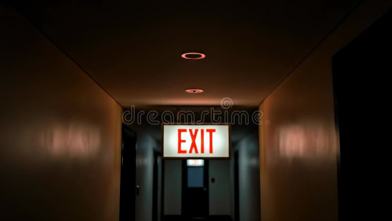AI Exit Sign Glows in Dim Hallway for Guidance Stock Footage - Video of ...
