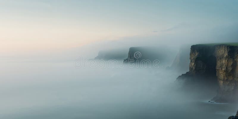 Dreamy Coastal Cliffs with Soft Ocean Mist. Stock Image - Image of soft ...