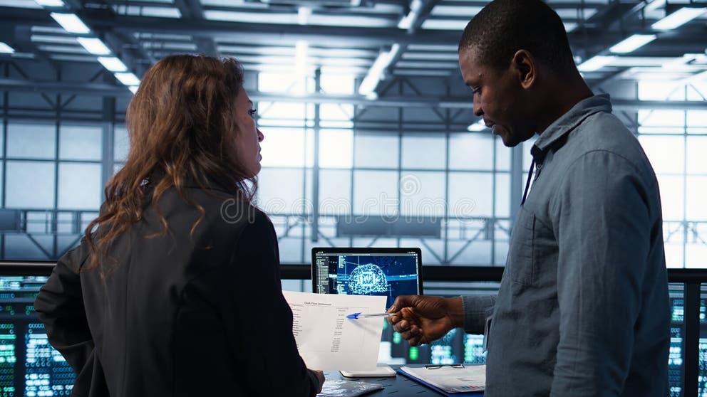 AI Server Room Admins Looking Over Financial Documents, Using Tablet ...