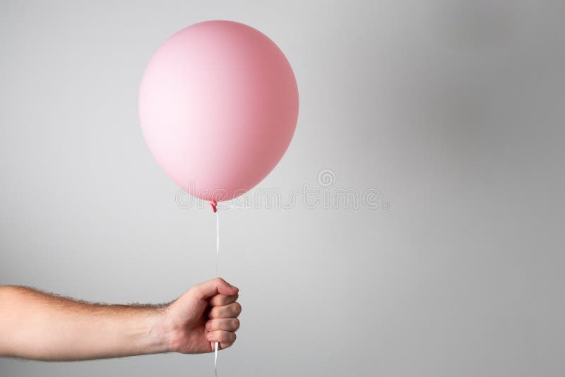 Air Balloon in Hand. Pink Air Balloon in a Man`s Hand. Balloon for the ...