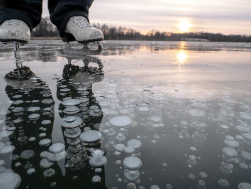 Air Bubbles Frozen in Ice, Ice Skating in the Evening at Sunset ...