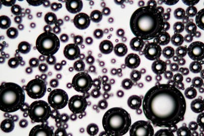 Air Bubbles in an Surfactant Fluid Under a Microscope Stock Photo ...