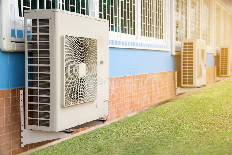 Air Compressor on Wall Pedestal with Siding Factory Wall Background ...