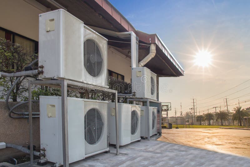 Air Compressor on Wall Pedestal with Siding Factory Wall Background ...