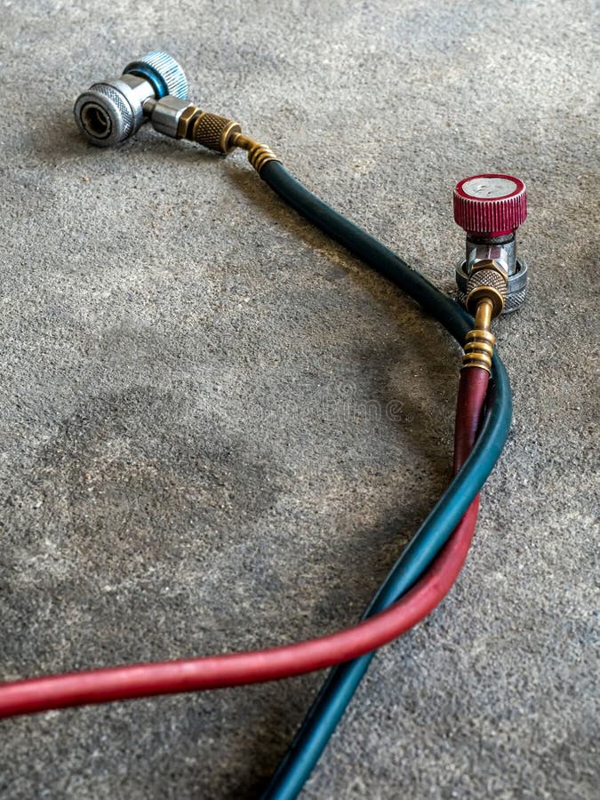 Air Conditioner Charging Hose on the Rough Concrete Flooring Stock ...