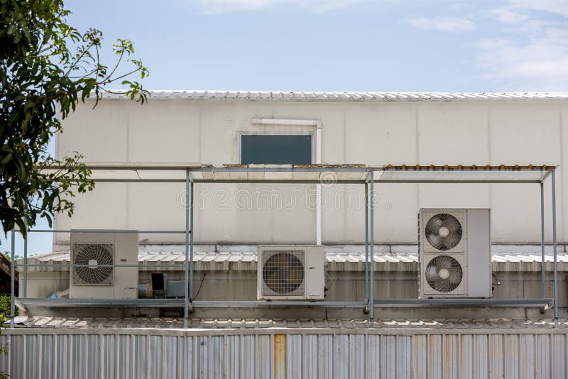 Air Conditioner Compressor Installed in Old Building. Outdoor Split ...