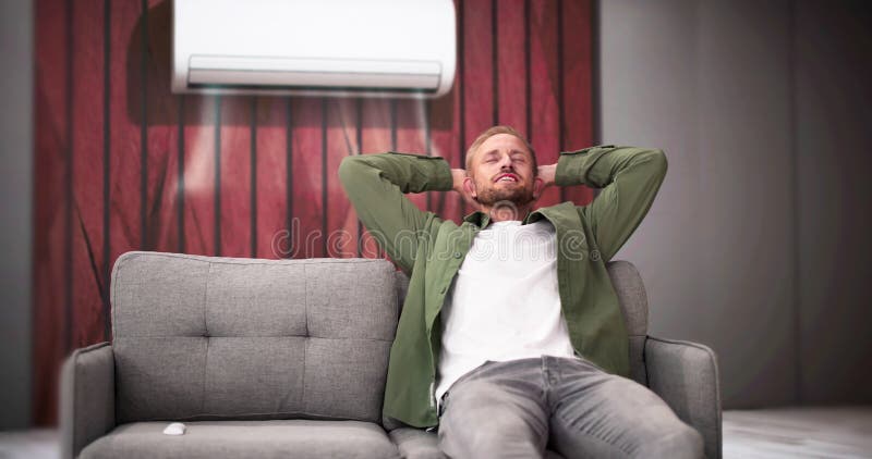 Air Conditioner in Living Room at Home Stock Photo - Image of holding ...