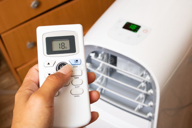 Air Conditioner Remote Control in Hand Closeup Stock Photo - Image of ...