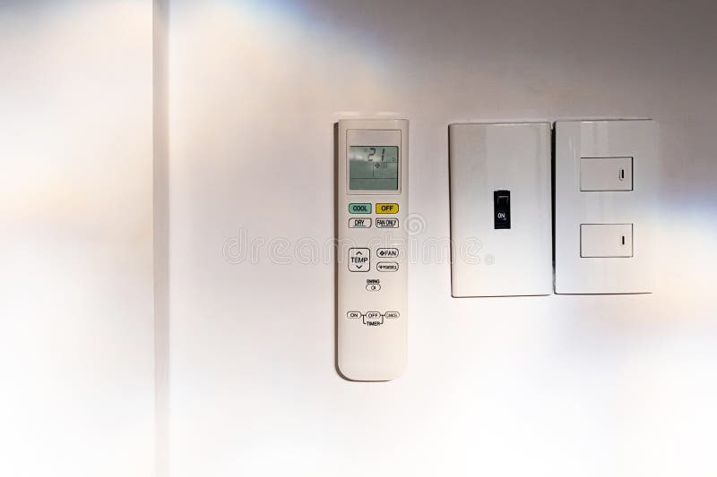 Air Conditioner Remote Control Hanging on Wall Stock Image - Image of ...