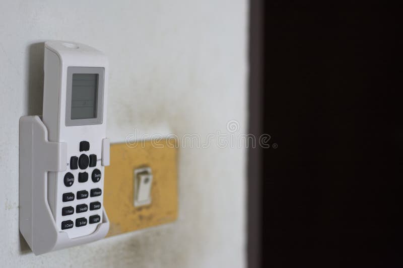 Air Conditioner Remote Control on White Wall. Stock Photo - Image of ...