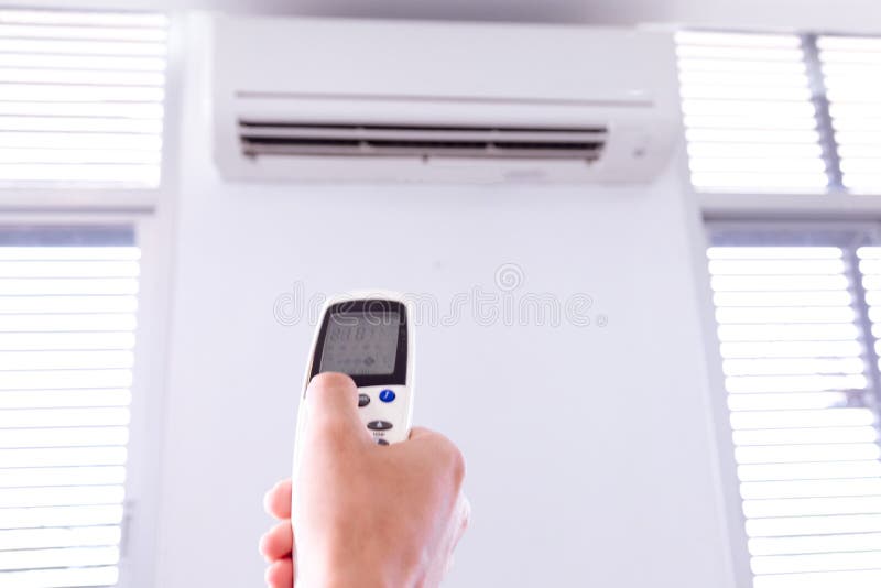 Air Conditioner with Remote Controller,inside the Room with Man ...