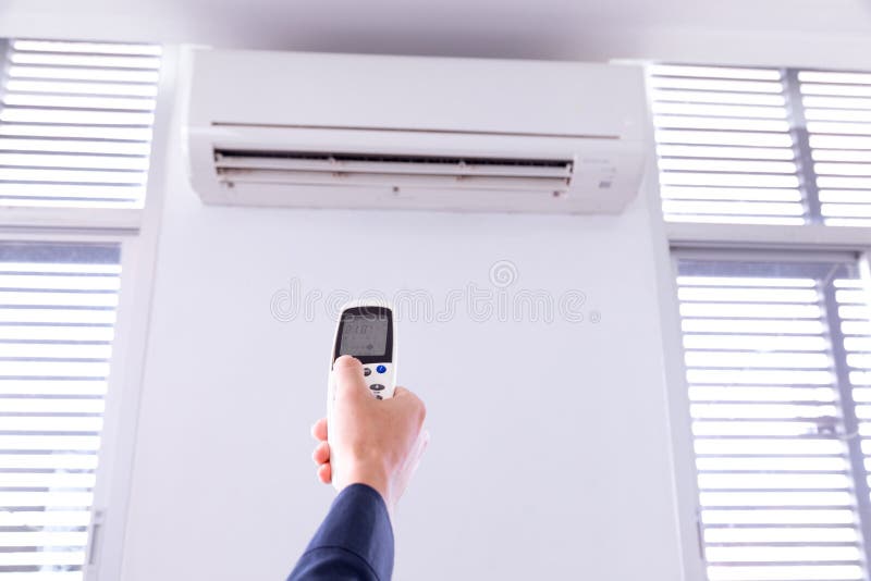 Air Conditioner with Remote Controller, Inside the Room with Man ...