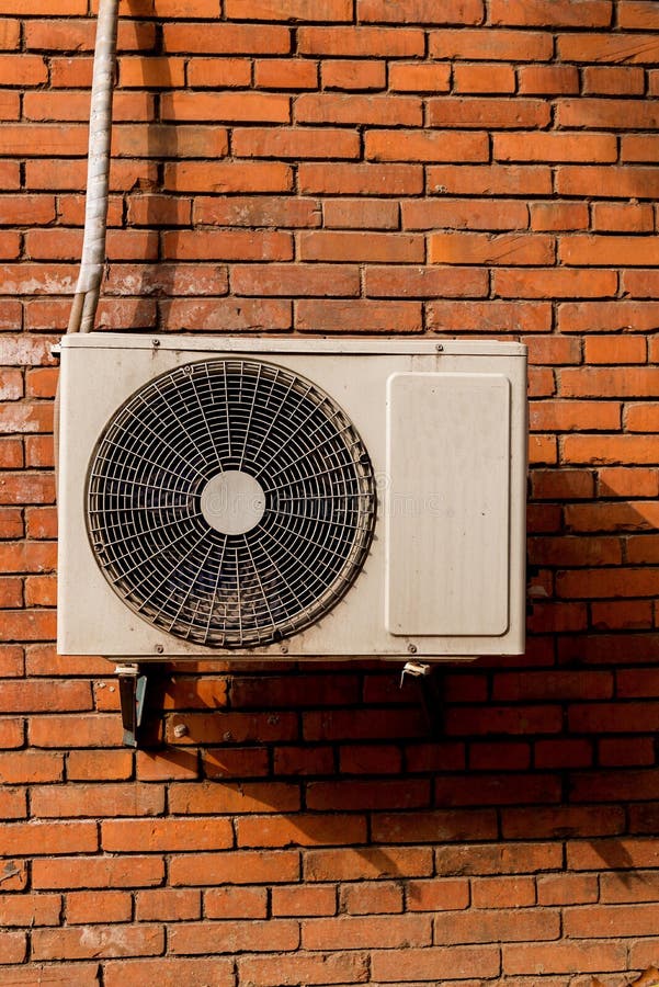 Air Conditioner Unit with Against Brick Wall Stock Image - Image of ...