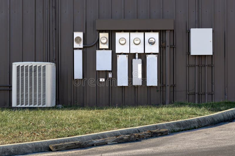 Air Conditioning Compressor and Electric Meters Outside Small Office ...
