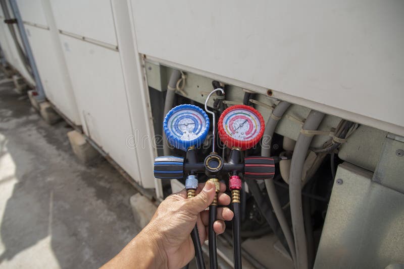 Air Conditioning, HVAC Service Technician Using Gauges To Check ...
