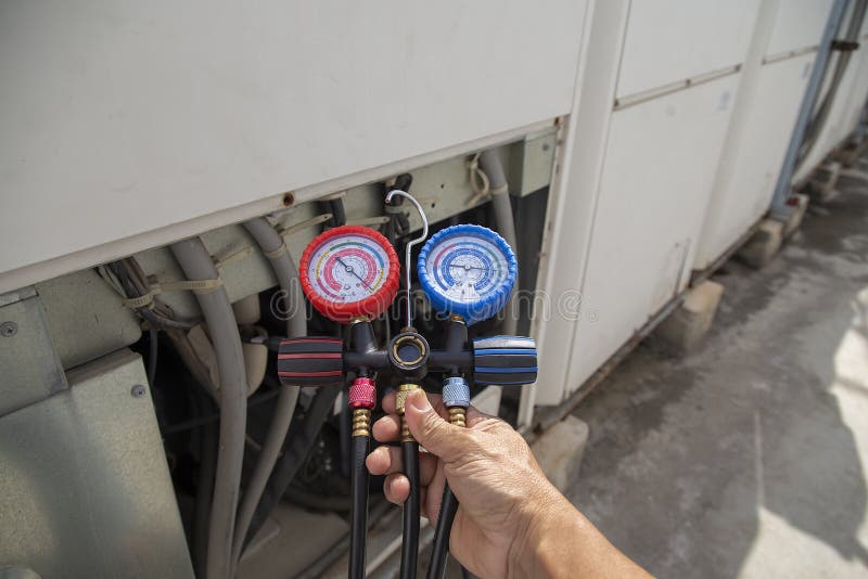 Air Conditioning, HVAC Service Technician Using Gauges To Check ...