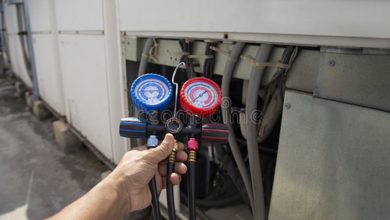 Air Conditioning, HVAC Service Technician Using Gauges To Check ...