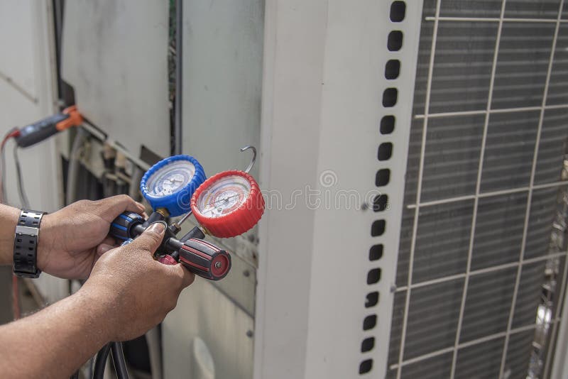 Air Conditioning, HVAC Service Technician Using Gauges To Check ...