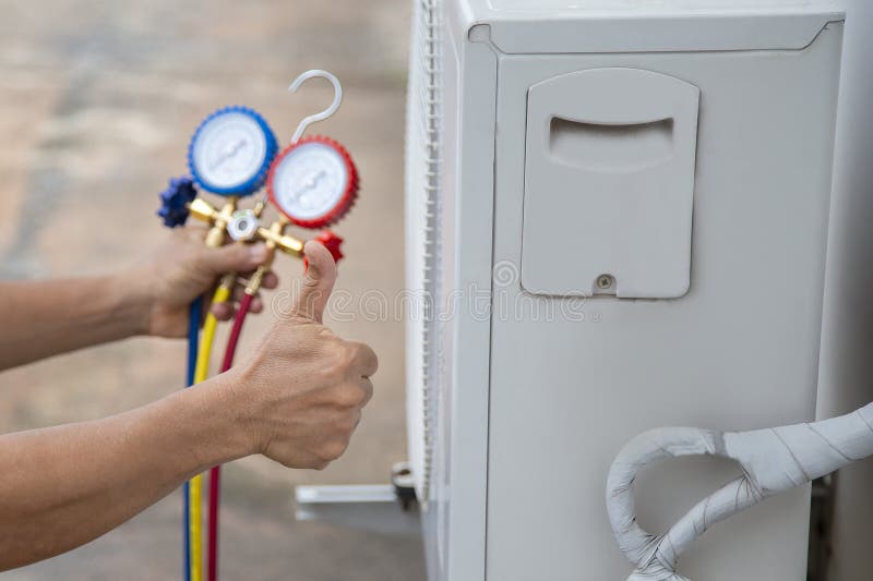 Technician Checking the Operation of the Air Conditioner. Stock Image ...