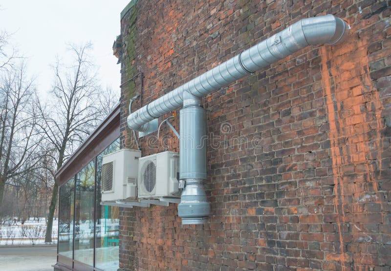 Air Conditioning and Metallic Pipes on a Brick Wall Stock Photo - Image ...