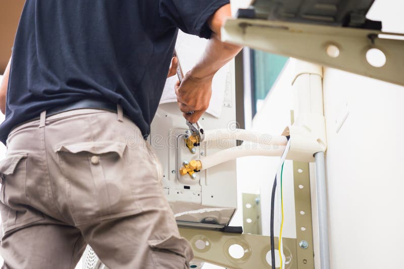 Air Conditioning Repair, Technician Man Hands Using a Wrench Fixing ...