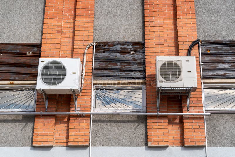 Air Conditioning System on a Building Wall Stock Image - Image of cage ...