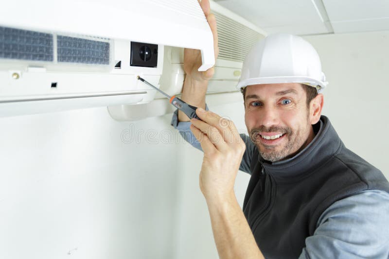 Air Conditioning Technician at Work Stock Image - Image of industrial ...