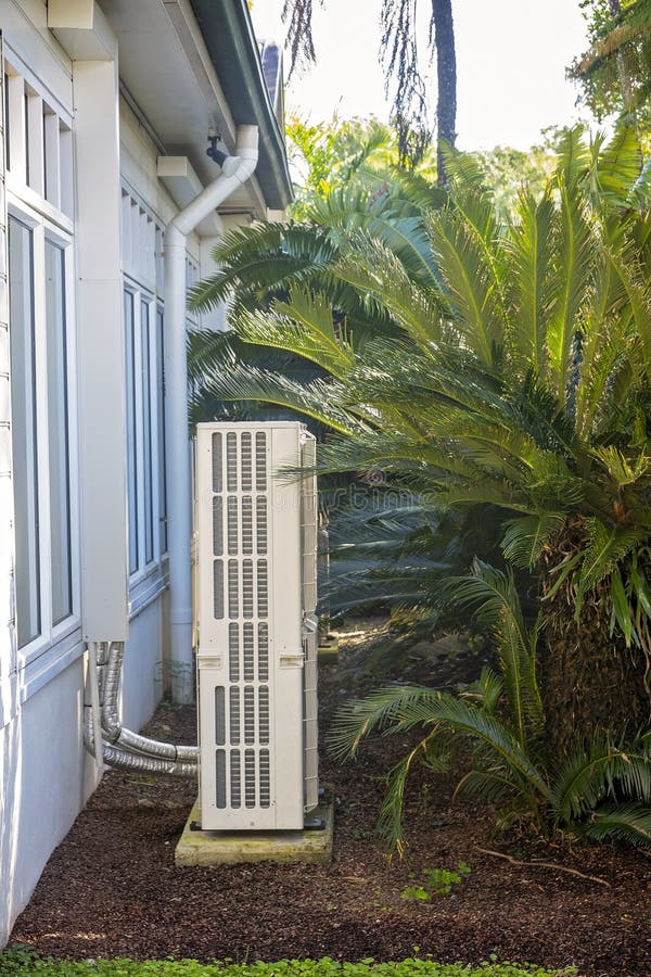 An Air Conditioning Unit by a House Stock Photo - Image of residential ...