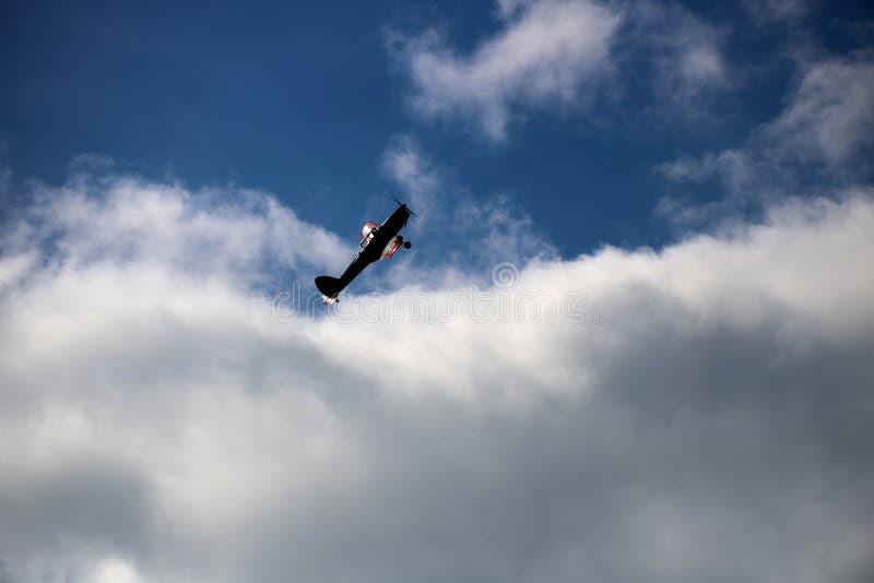 Air Force Monoplane Climbing into a Cloudy Sky at a Public Air Show ...