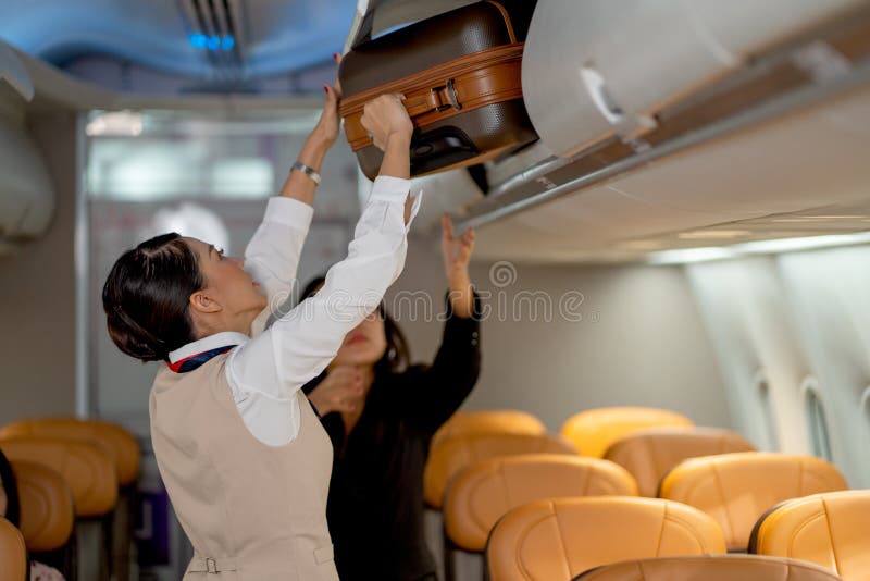 Air Hostess Or Cabin Crew Help And Support To Bring Luggage Of Business
