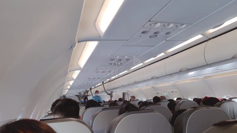 Flight Inside View Filled with Passengers on Board from Different Angle ...