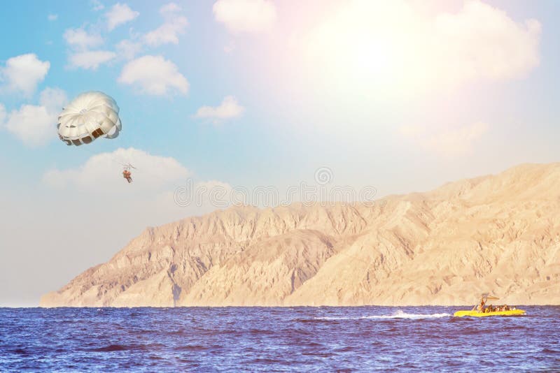 Air Parachute in the Sky. Water Parachute on Three Places. Parasailing ...