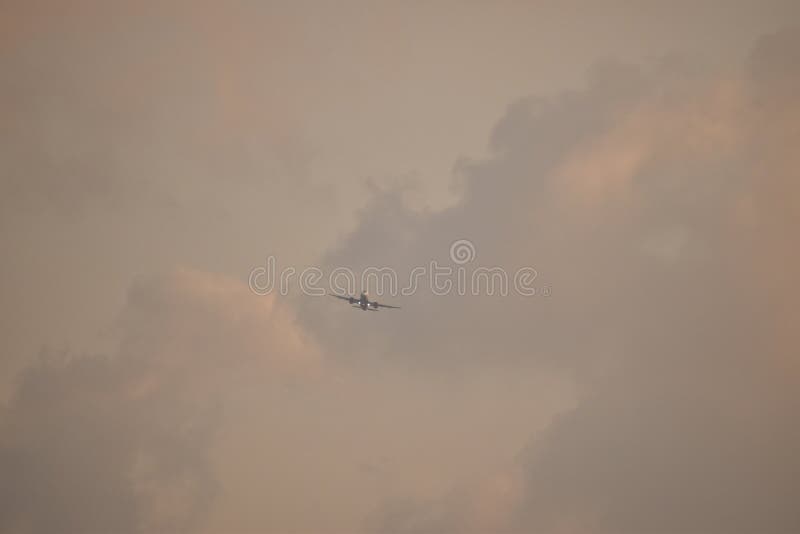 An Air Plain Taking Off in the Clouds during Sunset in India Stock ...