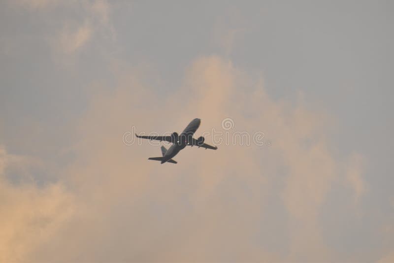 An Air Plain Taking Off in the Clouds during Sunset in India Stock ...