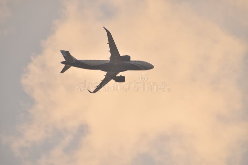 An Air Plain Taking Off in the Clouds during Sunset in India Stock ...