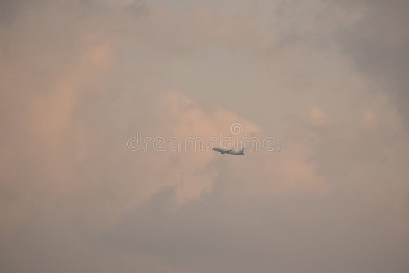An Air Plain Taking Off in the Clouds during Sunset in India Stock ...
