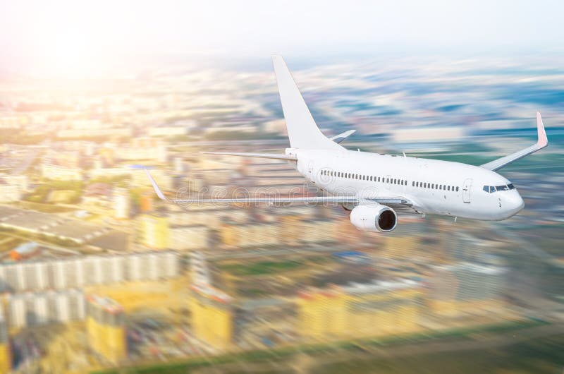 Air Plane Flying Over the High Buildings in Central Business District ...