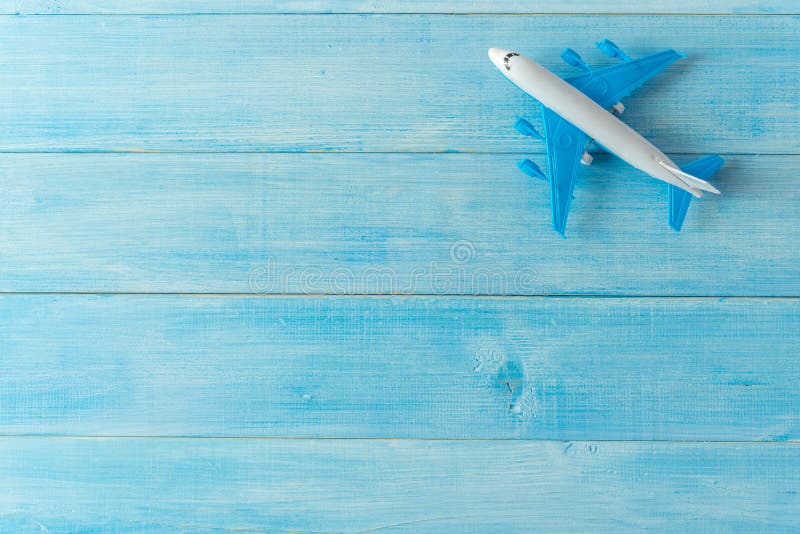 Air Plane Miniature Figure on Light Blue Wood Plank Background Stock ...
