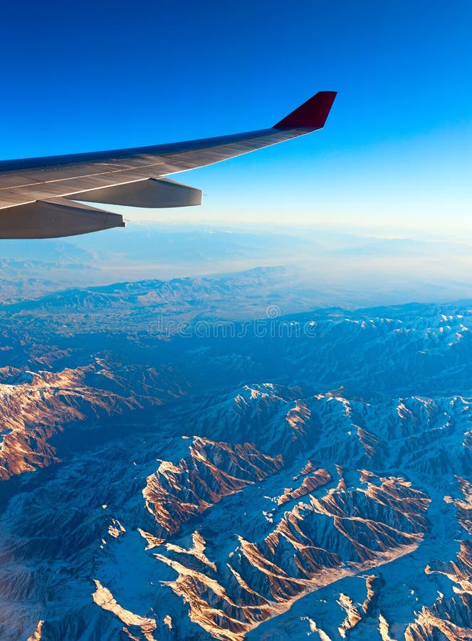 Air Travel Over the Mountains Stock Image - Image of industry, morning ...