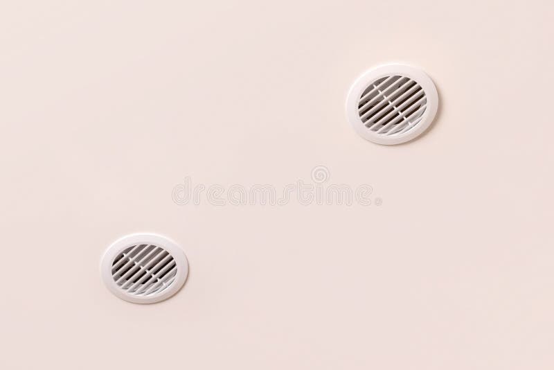 Air vents on beige ceiling stock image. Image of heating - 256025351