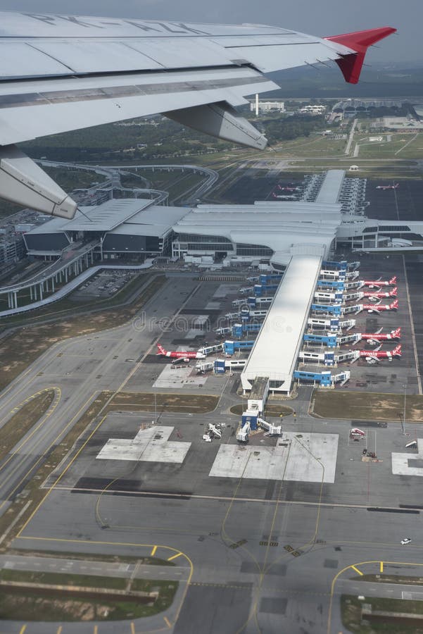 Airasia Planes Park at a Terminal at Jakarta Airport, Seen from a ... Airasia Planes Park at a Terminal at Jakarta Airport, Seen from a ...